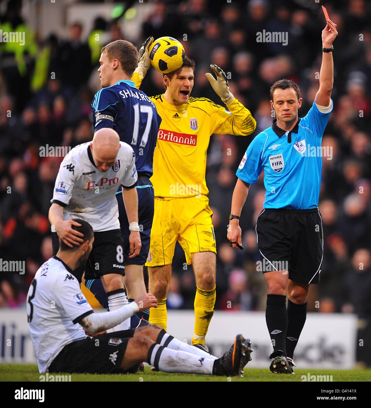 Stoke City's Ryan Shawcross (top left) is shown a red card by referee ...