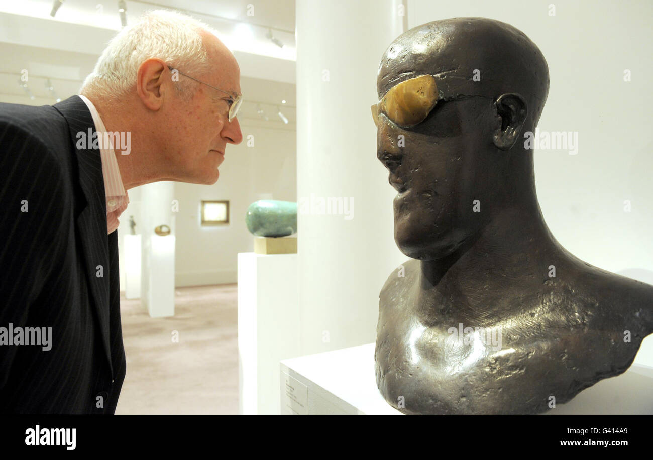 Chris Ingram poses with the sculpture Goggle Head, 1969, by Elisabeth ...