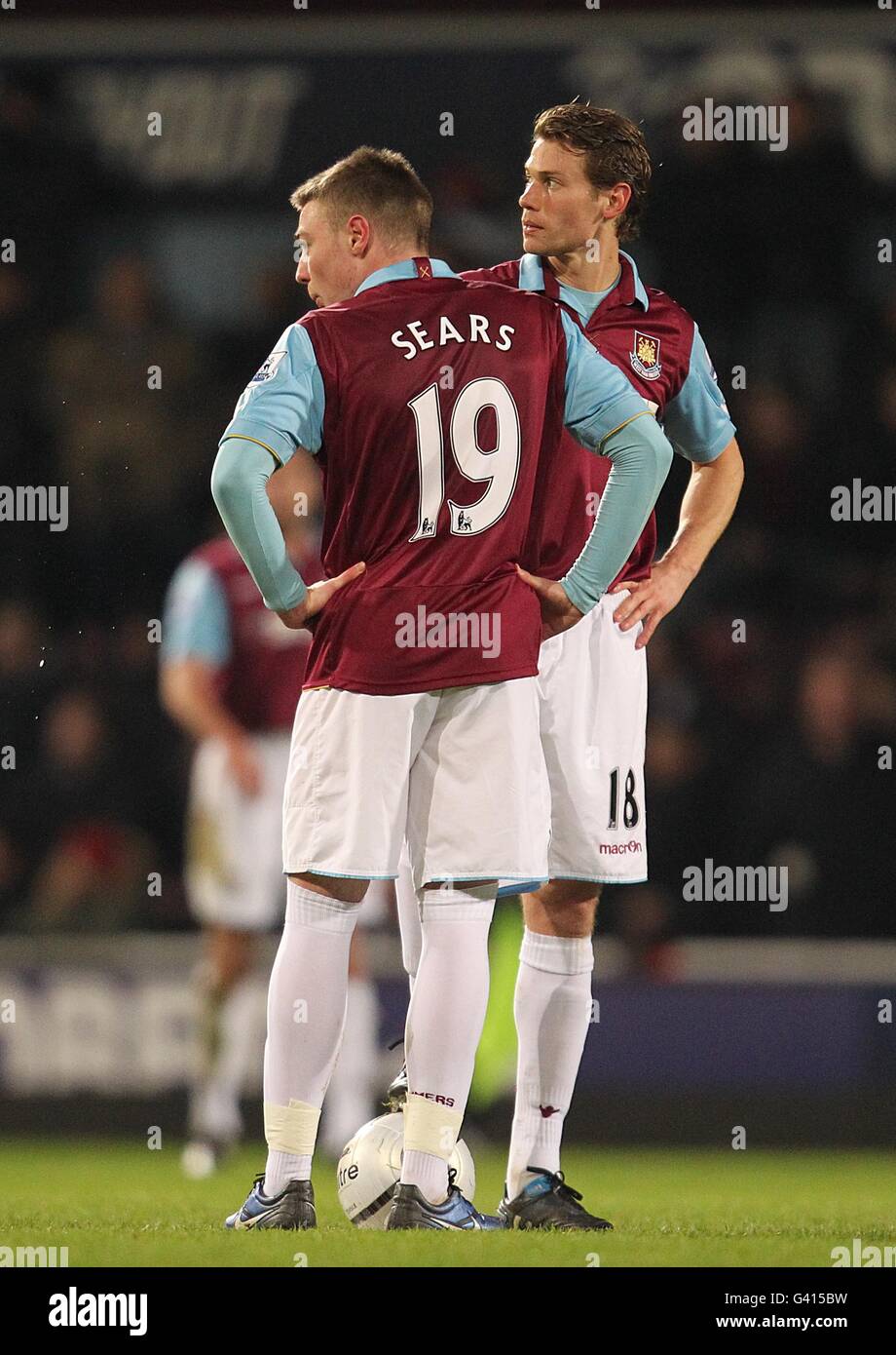 West Ham United's Fred Sears (lefT) and Jonathan Spector (right) stand ...