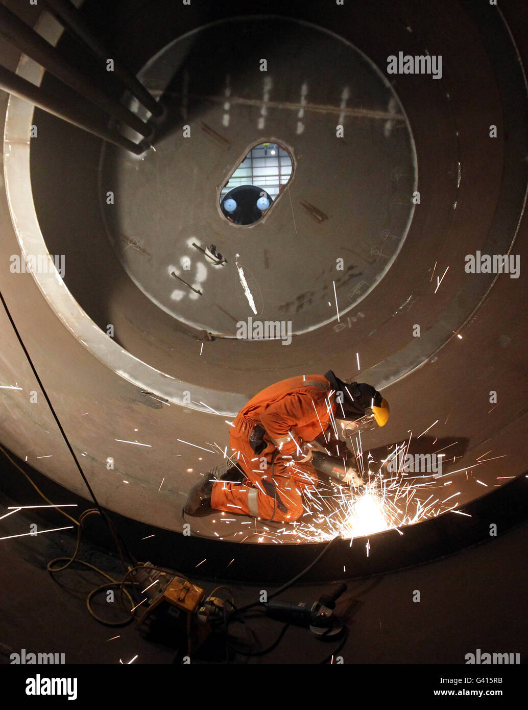 A welder inside a Power Module at Pelamis Wave Power factory in ...