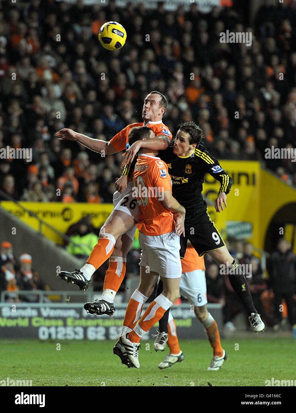 Blackpool's Charlie Adam (left) and Liverpool's Fernando Torres battle ...
