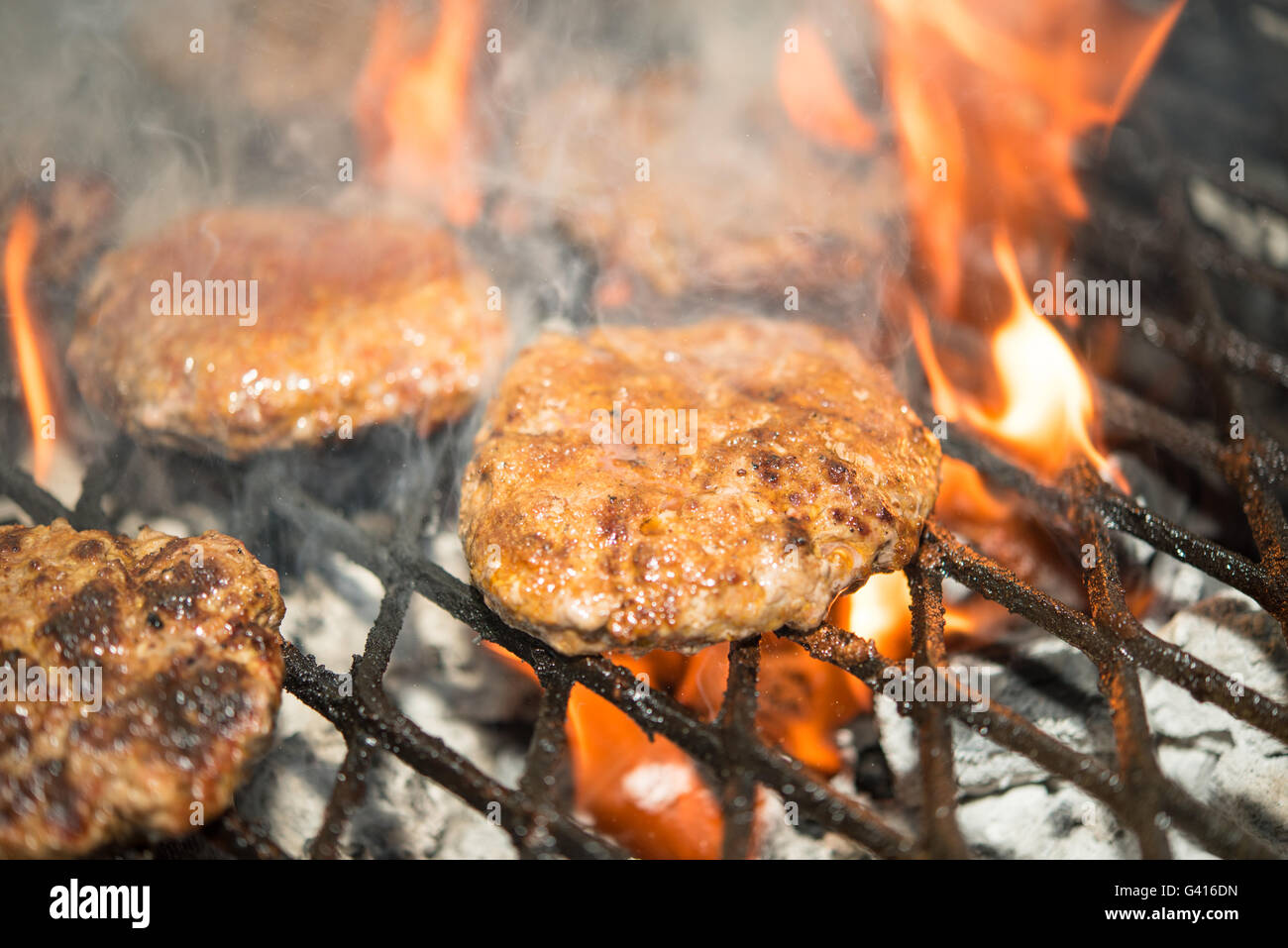 Turning burgers hi-res stock photography and images - Alamy