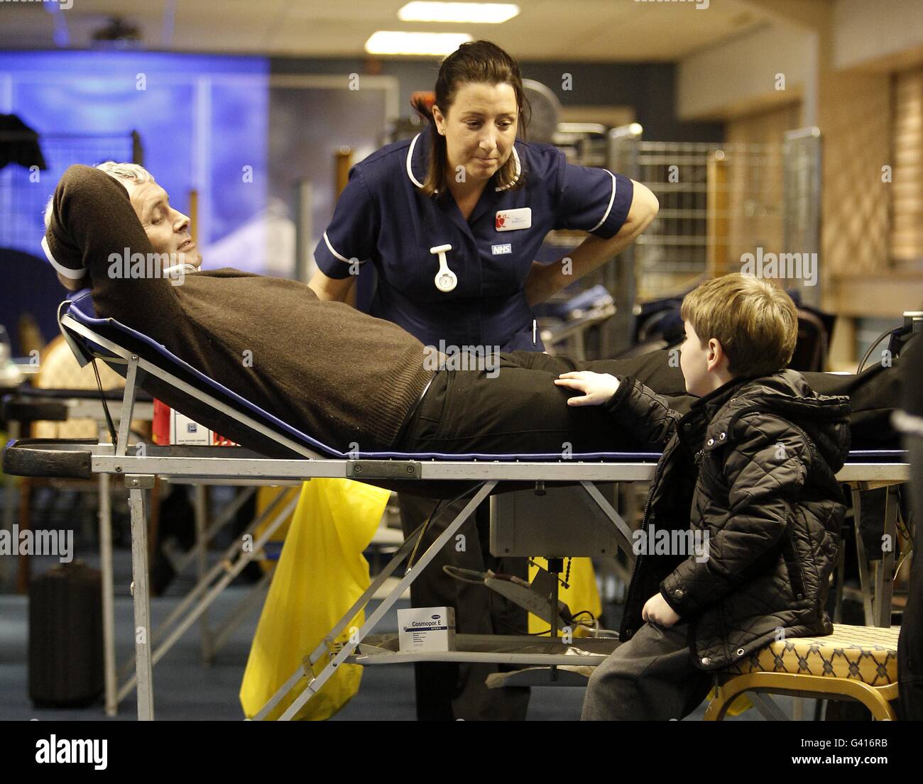 Tony Doyle and his son Shay (6) gives blood at goodison park home of ...