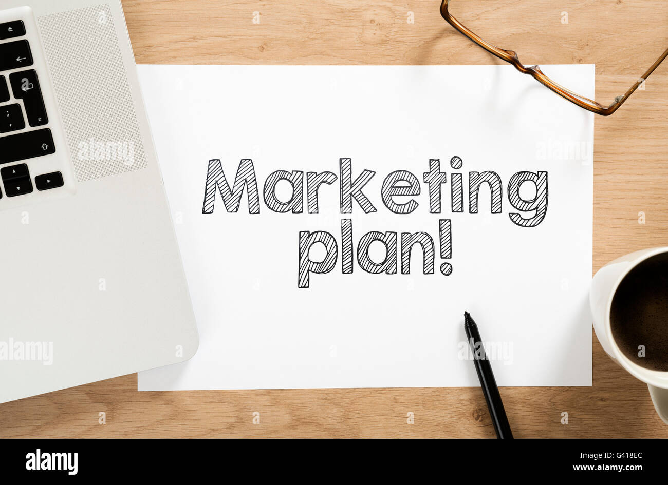 "Marketing plan!" written paper on the office desk Stock Photo - Alamy