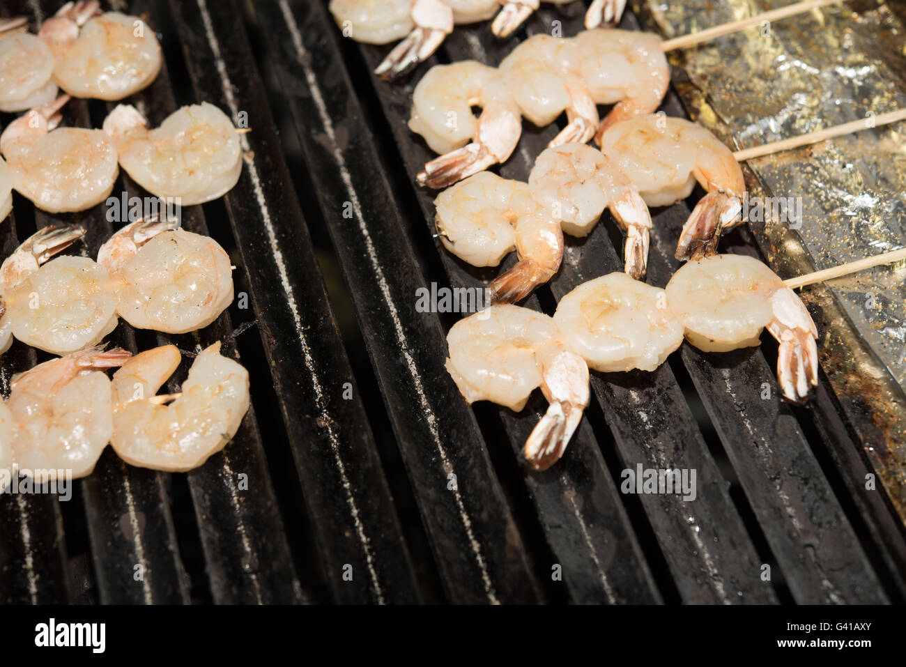 Cooking prawns grilled in the restaurant Stock Photo - Alamy