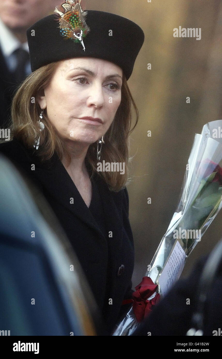 A mourner following the funeral of singer-songwriter Gerry Rafferty at ...