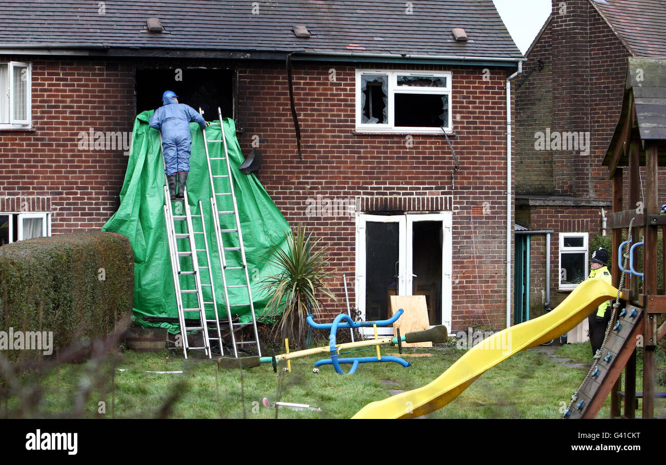 Police and forensic investigators at the property in Hulland Ward, near ...