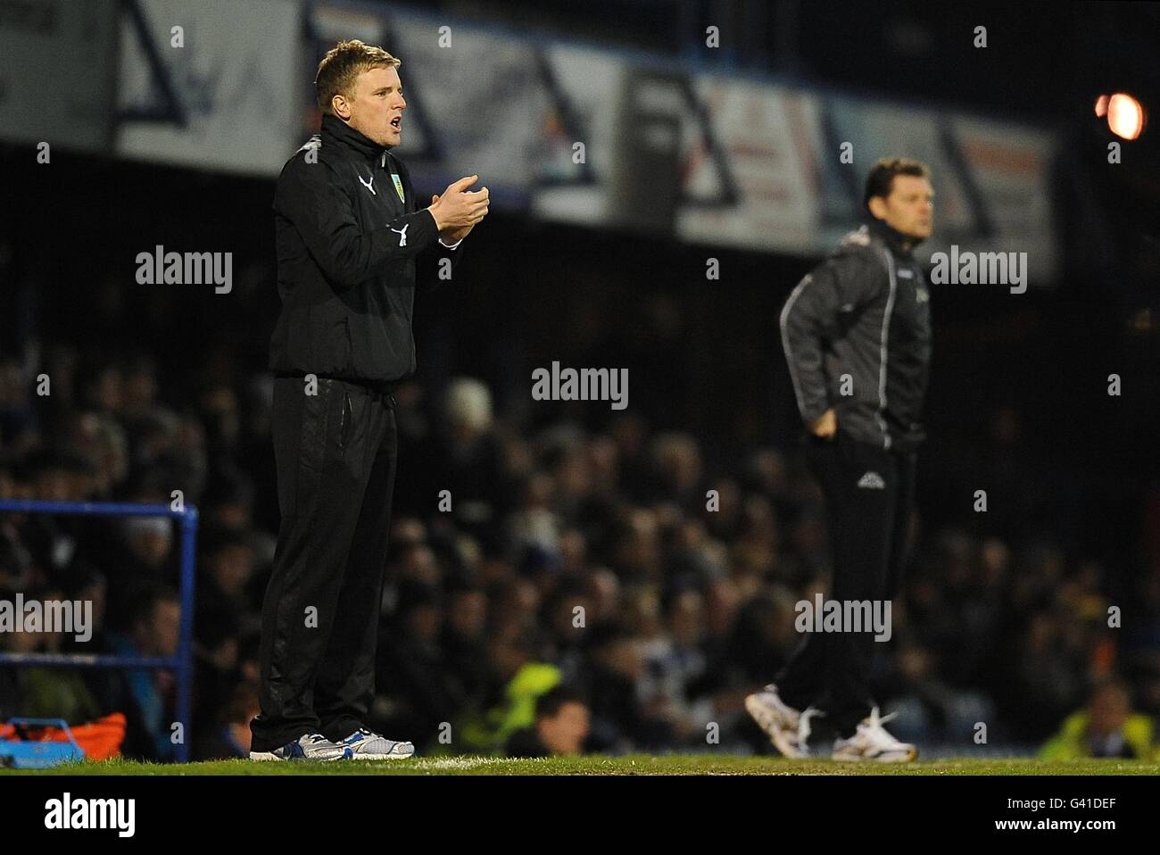 Burnley manager Eddie Howe (left) and Portsmouth manager Steve ...
