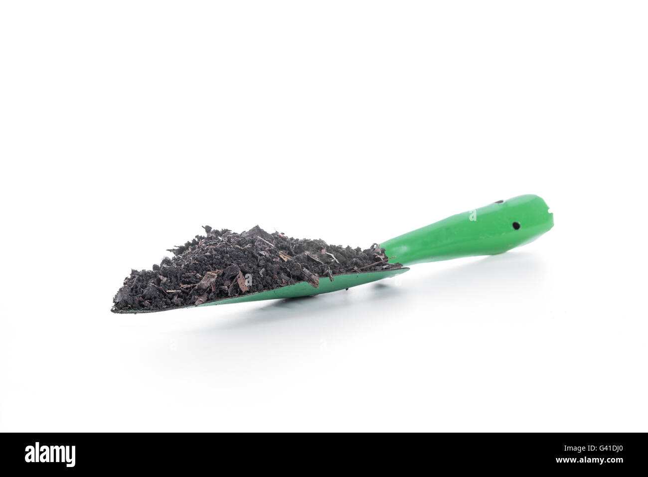 Green Garden trowel with soil on white background Stock Photo - Alamy