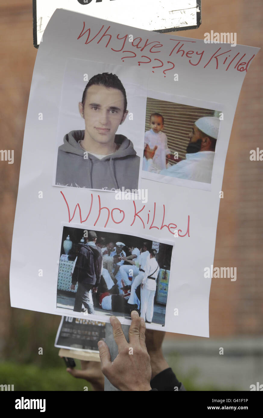 A poster with pictures of dead activists Khalid Said and Elsaid Bilal ...