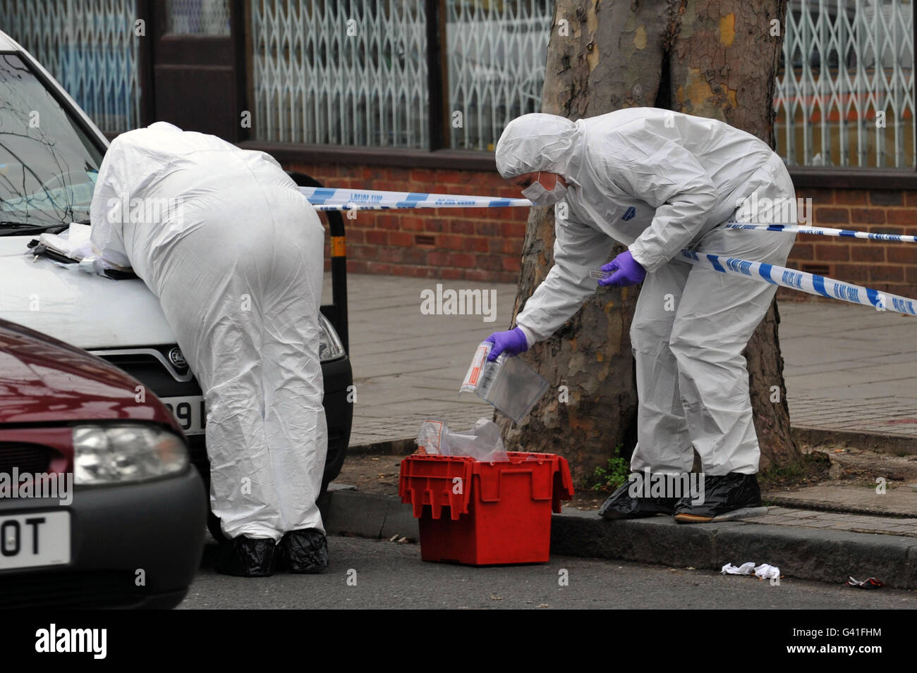 Police forensics officers attend the scene in East Dulwich after a man ...