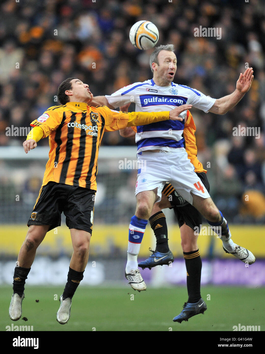 Queens Park Ranger's Shaun Derry and Hull City's James Harper battle ...