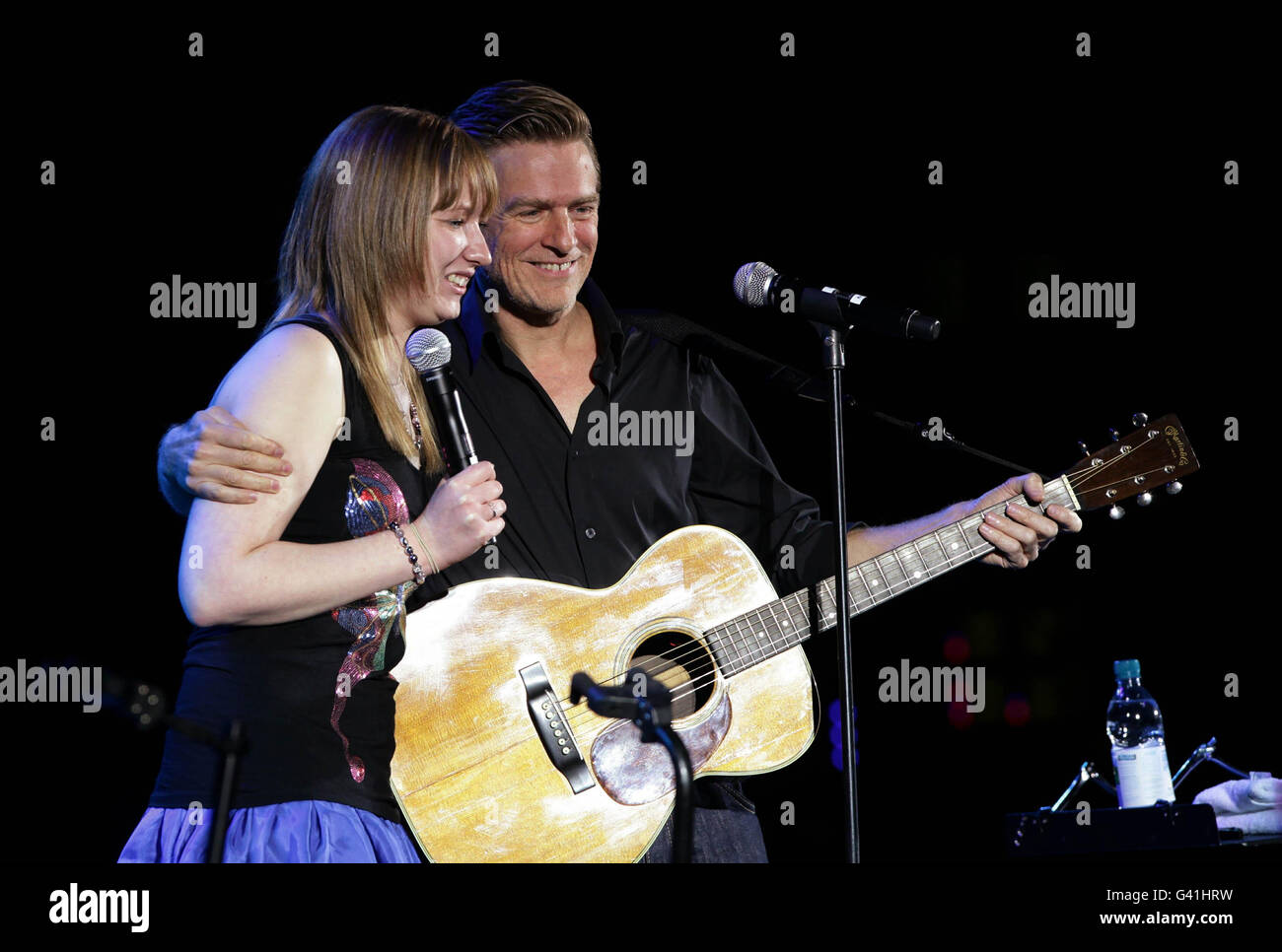 Bryan Adams performing with cancer survivor patient of the Killing ...