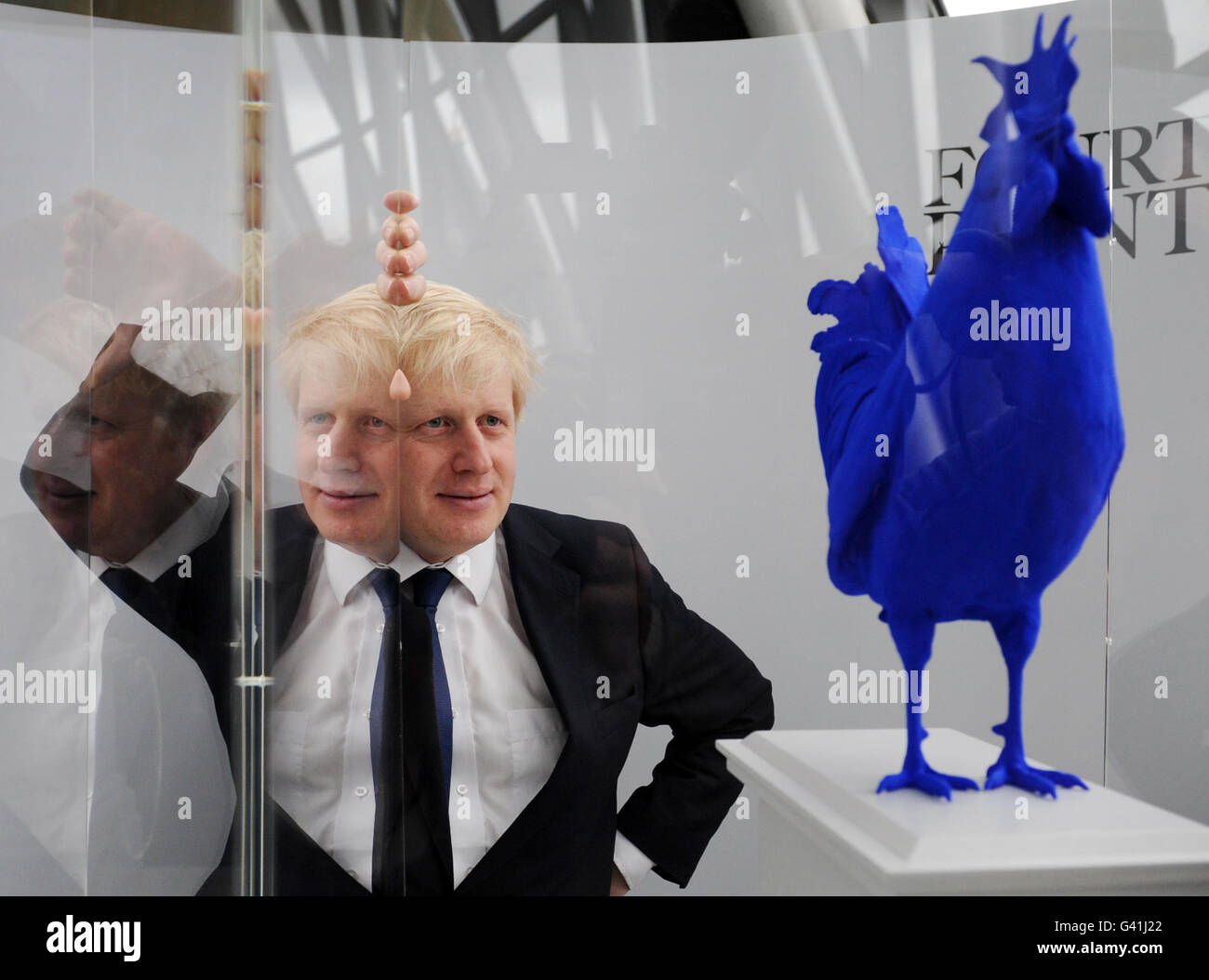 London Mayor Boris Johnson with a sculpture of a blue cockeral as he ...