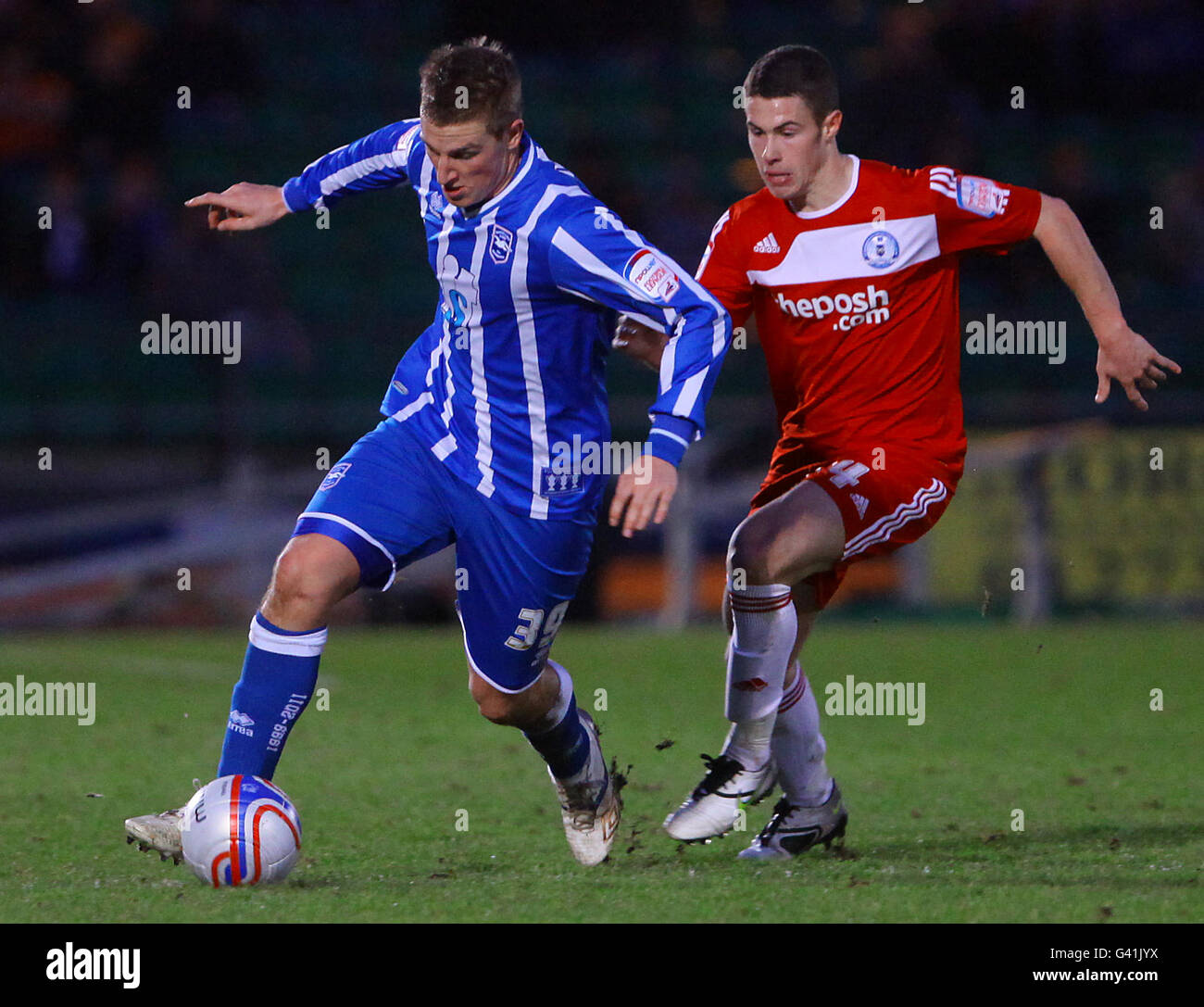 Brighton's Chris Wood (left) takes on Peterborough's Tommy Rowe during ...