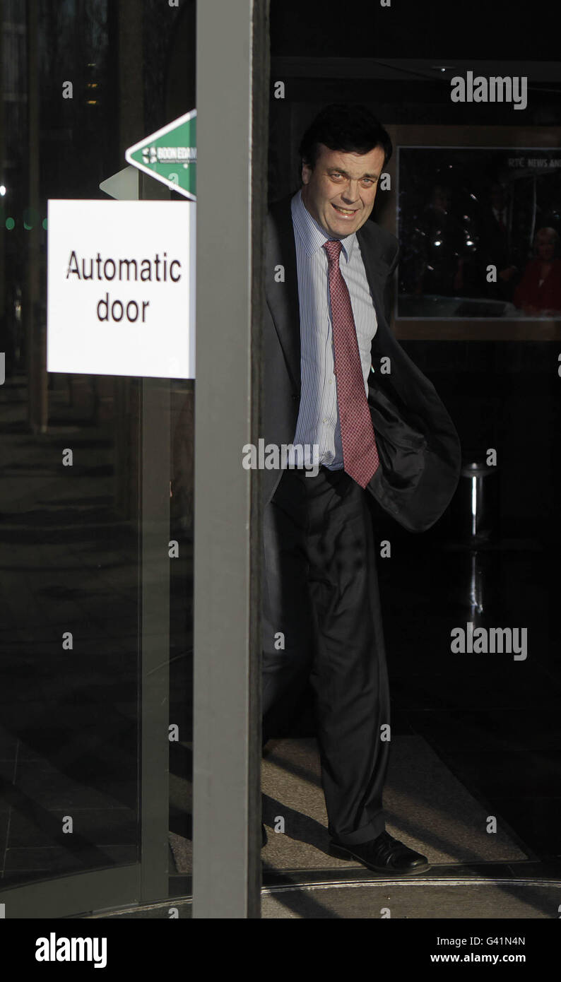 Finance Minister Brian Lenihan leaves RTE Studios in Dublin after he ...
