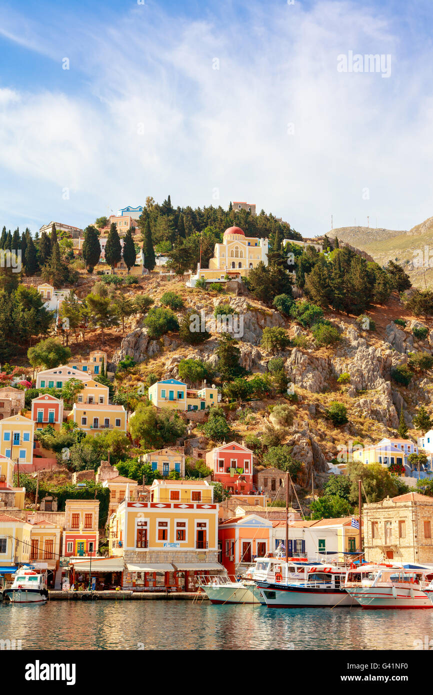 Neo-Classical houses in picturesque harbor on the island of Symi in ...