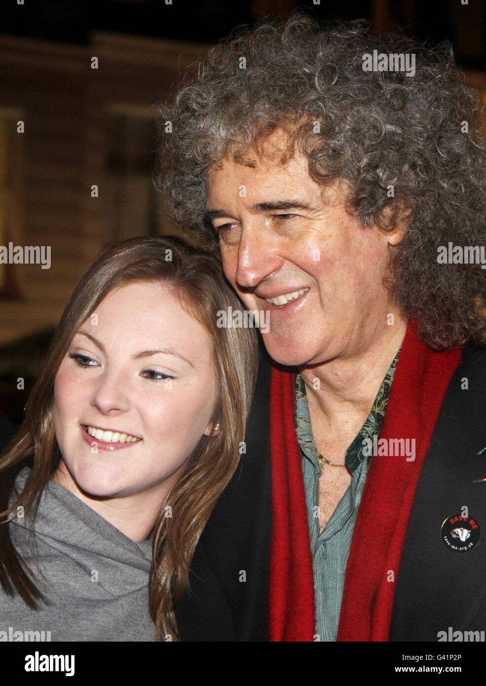 Brian May has a photo taken with a fan as he arrives at the Kings ...