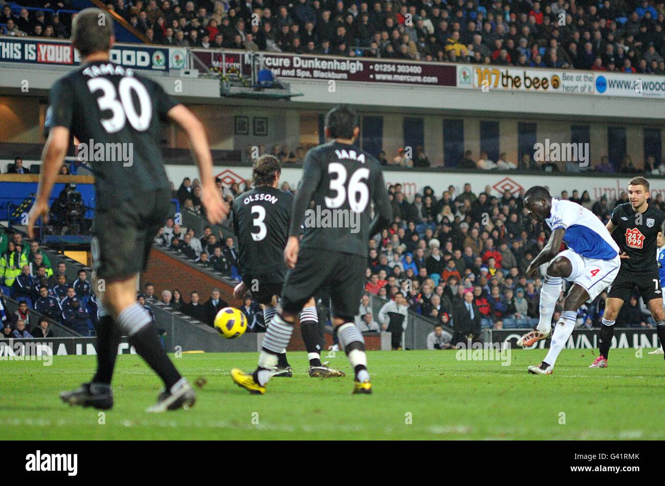 Blackburn Rovers' Christopher Samba (right) has a shot on goal Stock ...