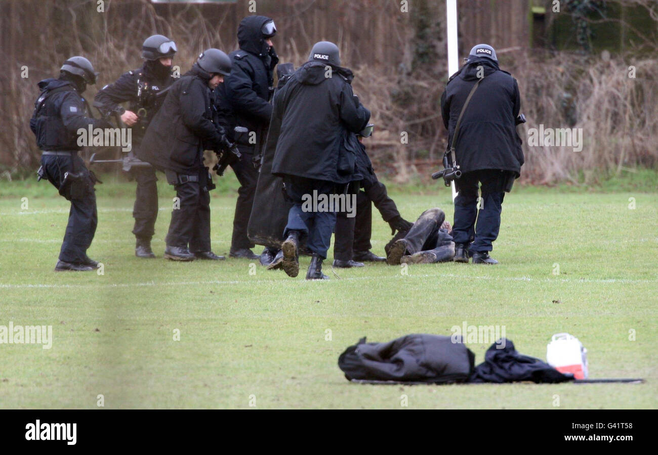 Armed Police Rush Towards A Man After He Shot Himself During A Stand
