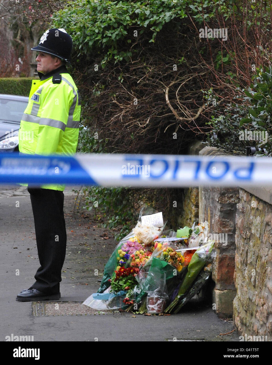 Police guard the entrance to the flat of Joanna Yeates in Bristol after ...
