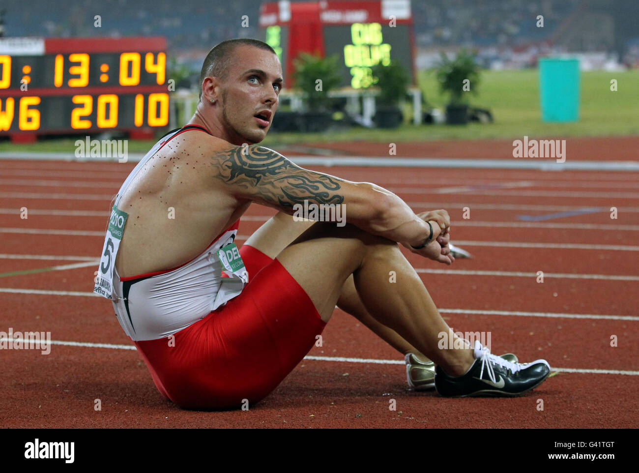 Canada's Jared Connaughton looks dejected as he sits on the track after ...