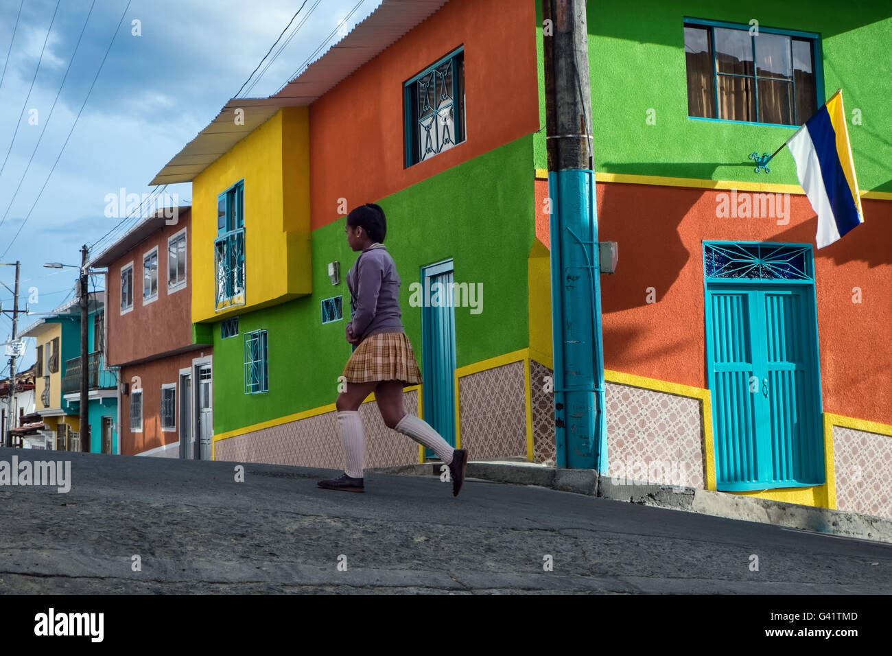 Schoolgirl Walking in Colorful Neighbourhood Stock Photo - Alamy