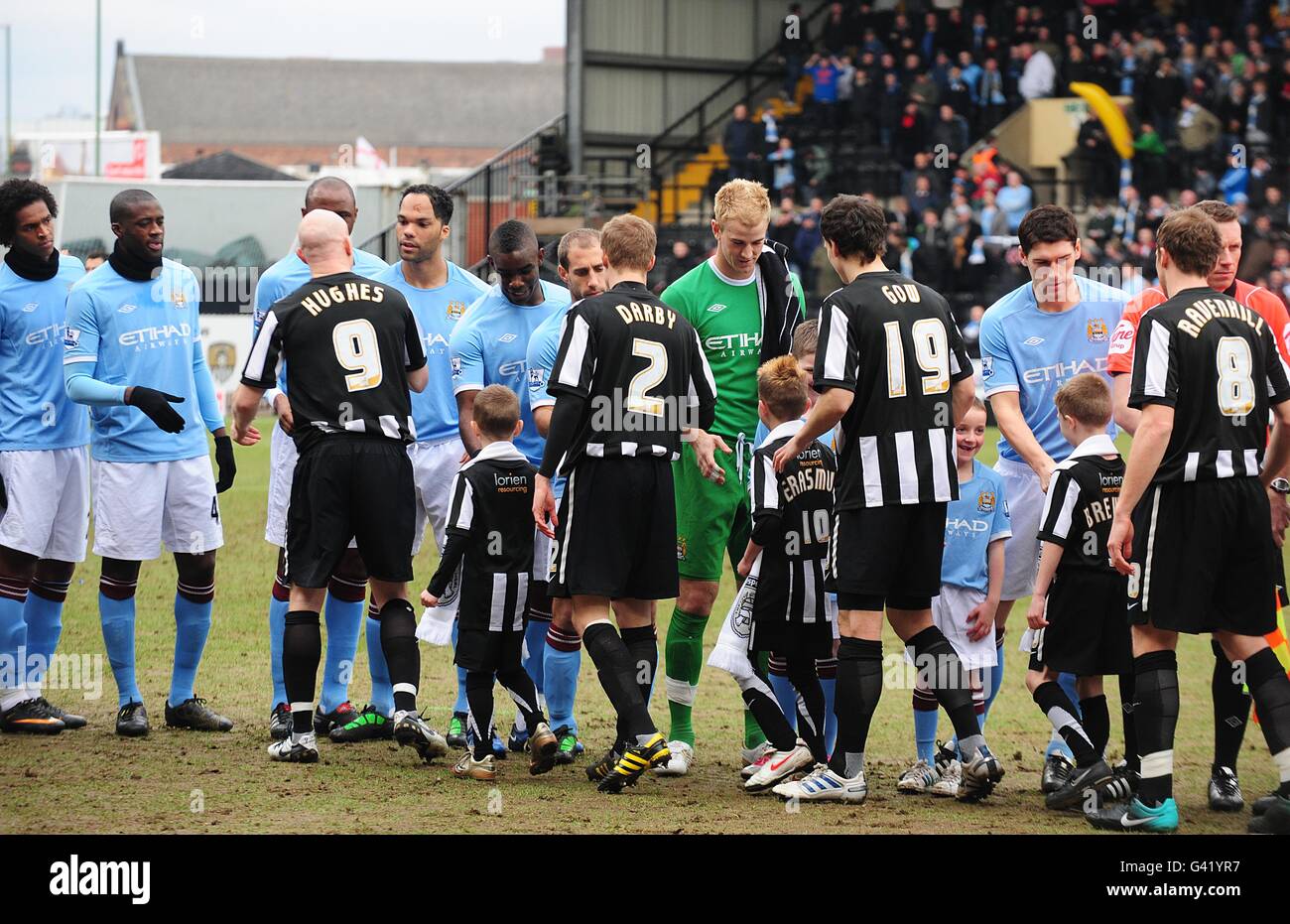 The Notts County team shake hands with the Manchester City team Stock ...