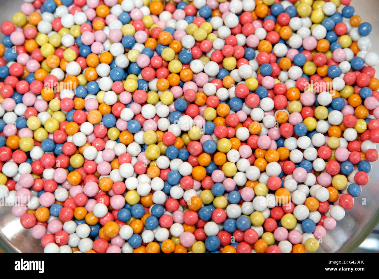 Heap of sugared colorful sweet dragees as a background Stock Photo - Alamy
