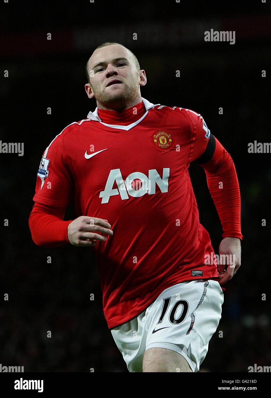 Manchester United's Wayne Rooney runs to celebrate scoring the opening ...