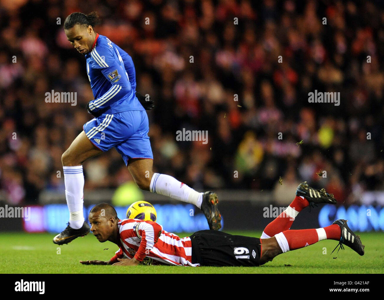 Chelsea's Didier Drogba (left) in action with Sunderland's Titus ...