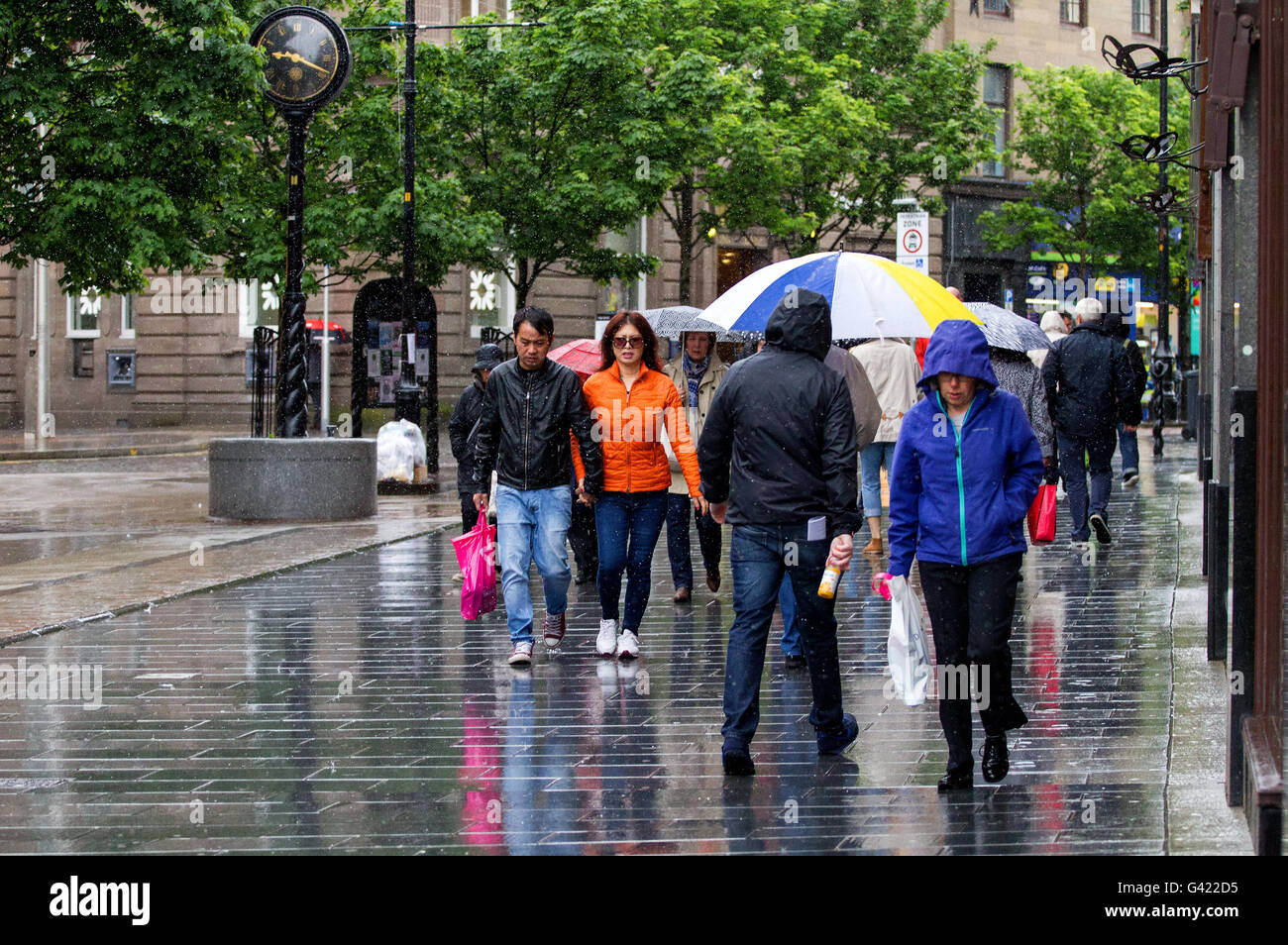 Rain wet weather raincoats hi-res stock photography and images - Alamy