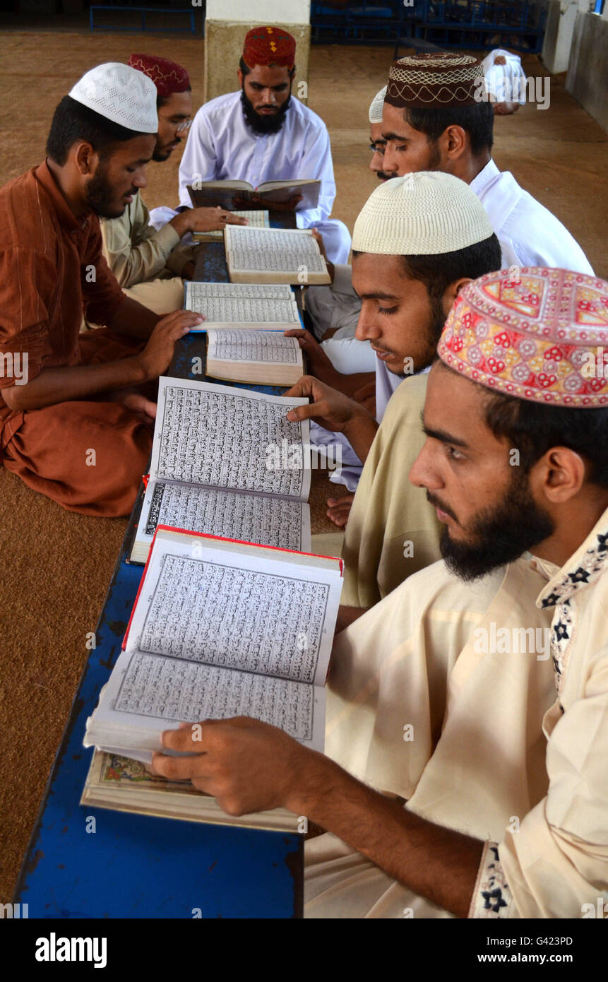 Lahore. 17th June, 2016. Pakistani Muslims read holy Quran at a mosque ...