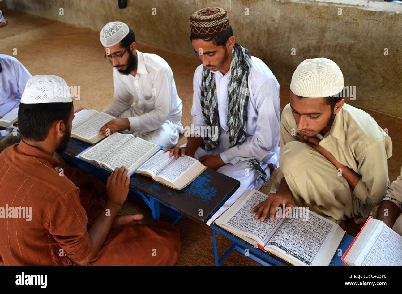 Lahore. 17th June, 2016. Pakistani Muslims read holy Quran at a mosque ...