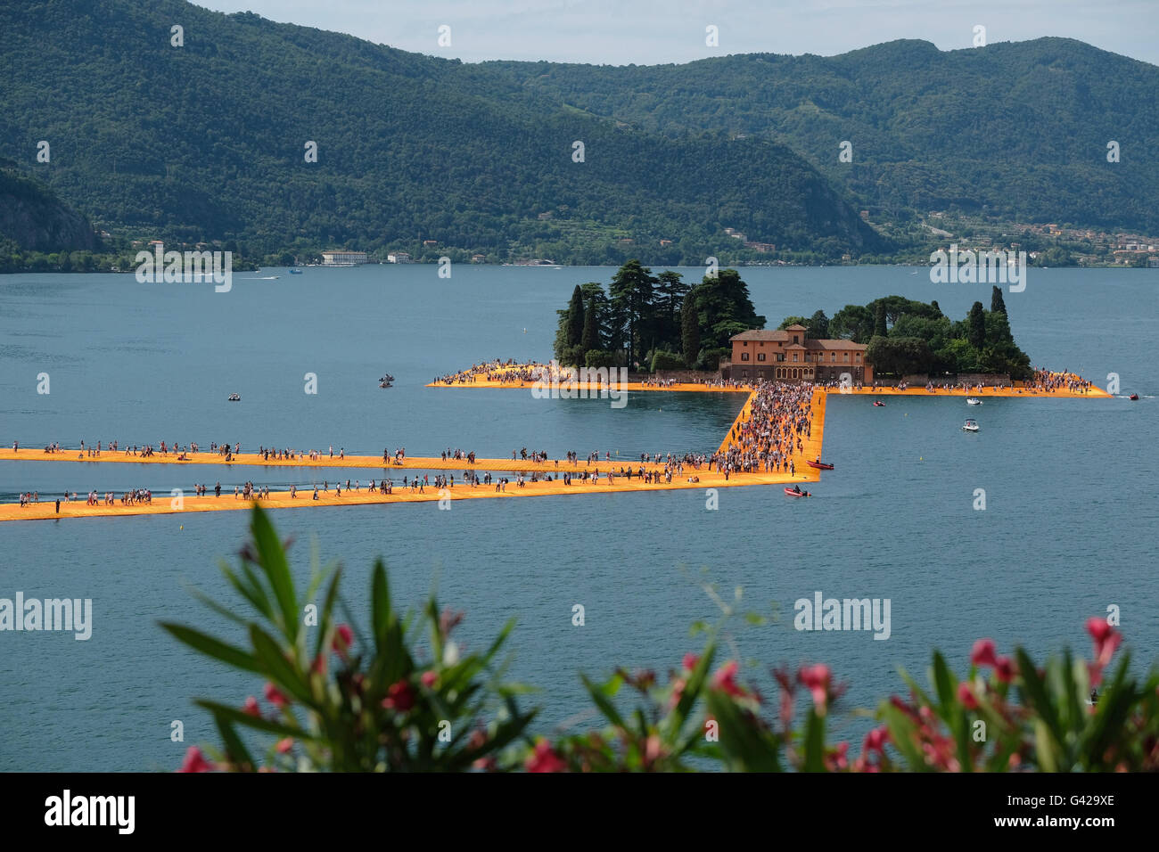 Paratico, Italy. 18th June, 2016. Visitors walk across floating piers ...