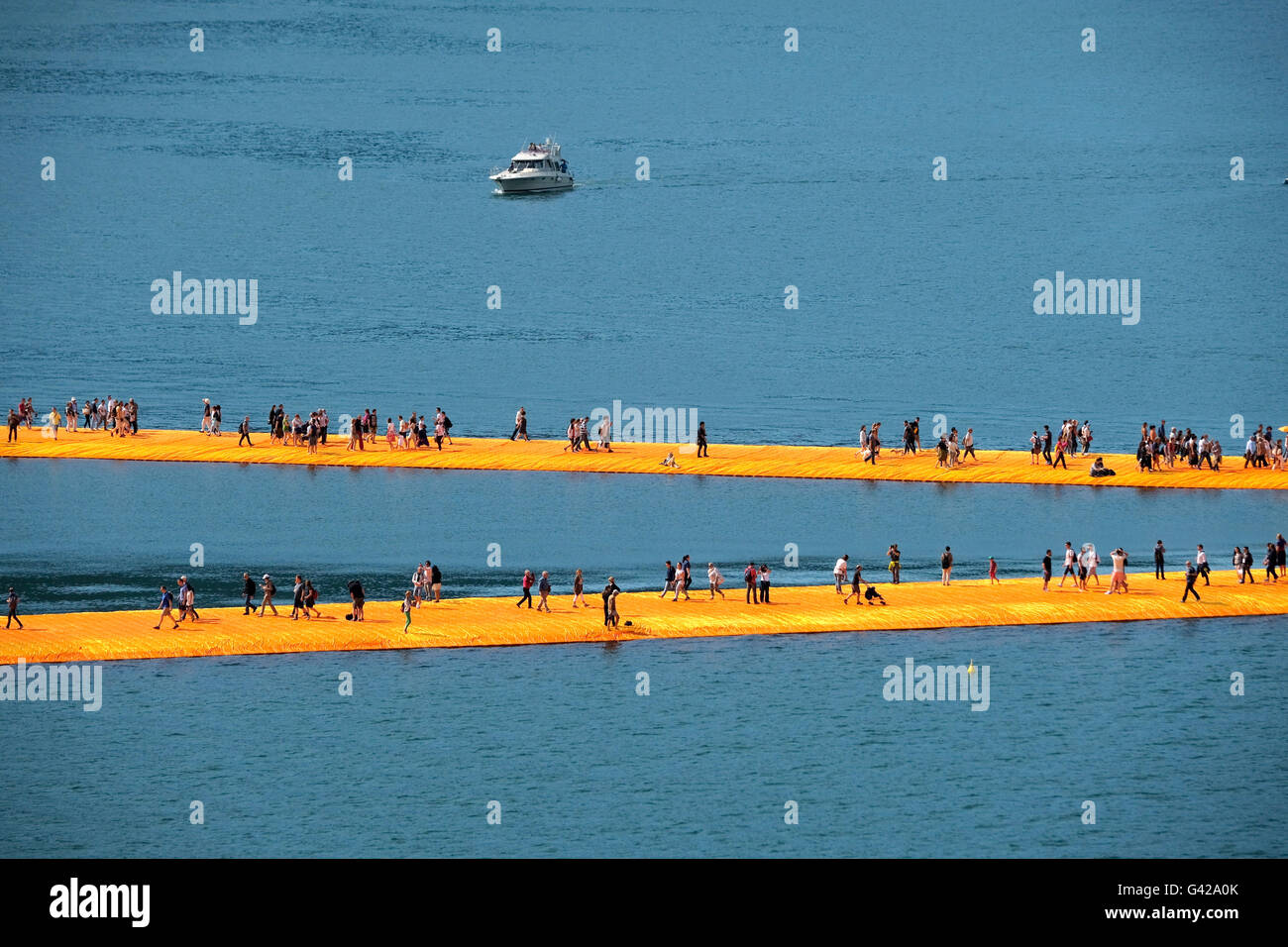Paratico, Italy. 18th June, 2016. Visitors walk across floating piers ...