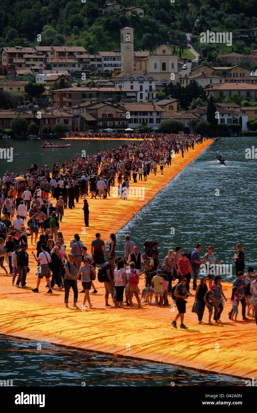 Paratico, Italy. 18th June, 2016. Visitors walk across floating piers ...