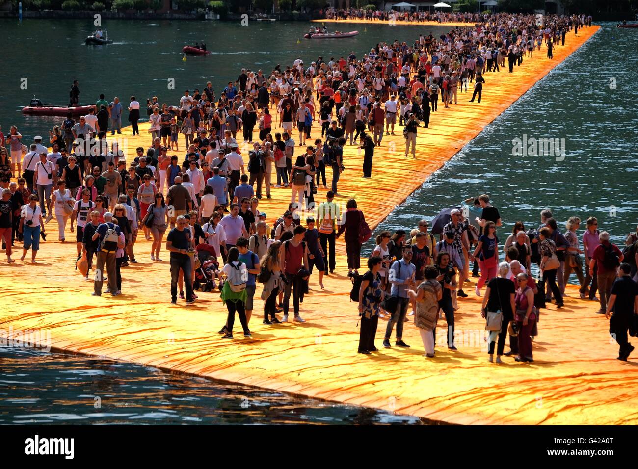 Paratico, Italy. 18th June, 2016. Visitors walk across floating piers ...