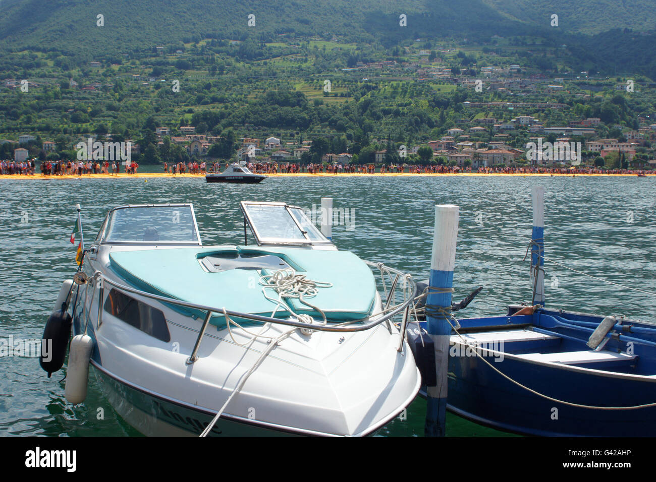 Paratico, Italy. 18th June, 2016. Visitors walk across floating piers ...