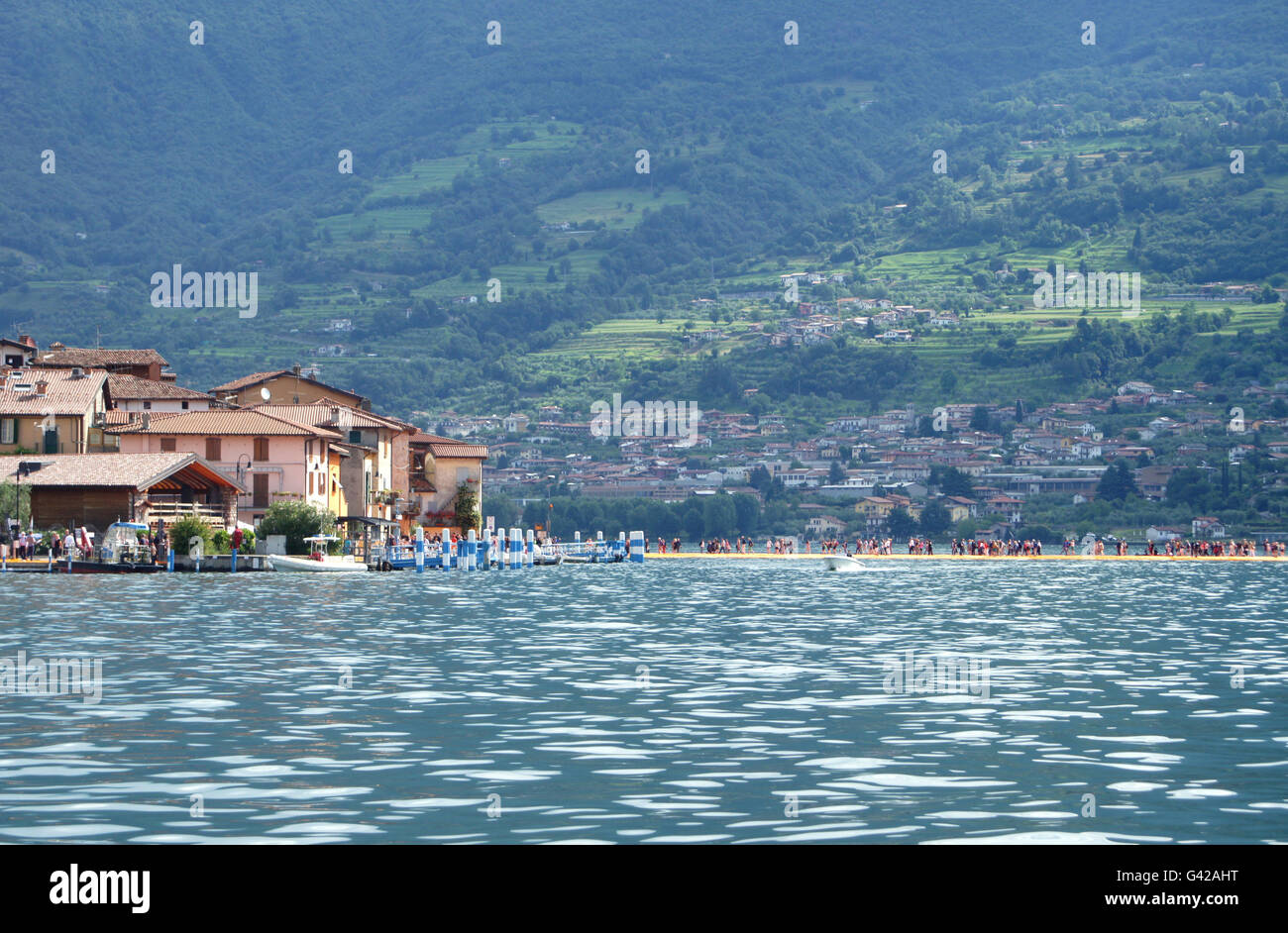 Paratico, Italy. 18th June, 2016. Visitors walk across floating piers ...