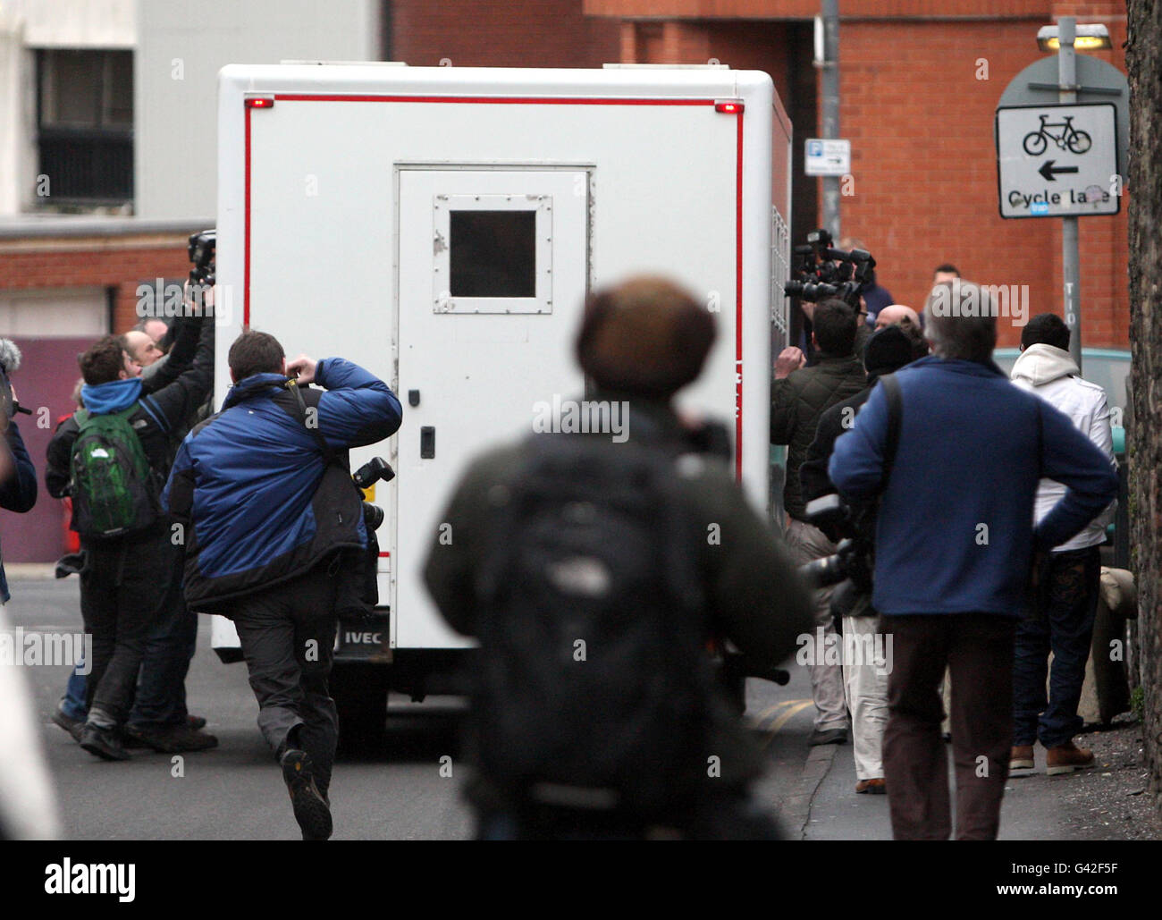 Photographers chase after a van believed to be carrying Dutch engineer ...