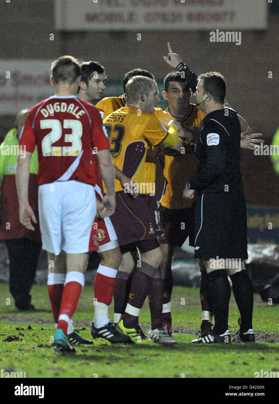 Referee Kevin Wright is surrounded by players after sending off ...