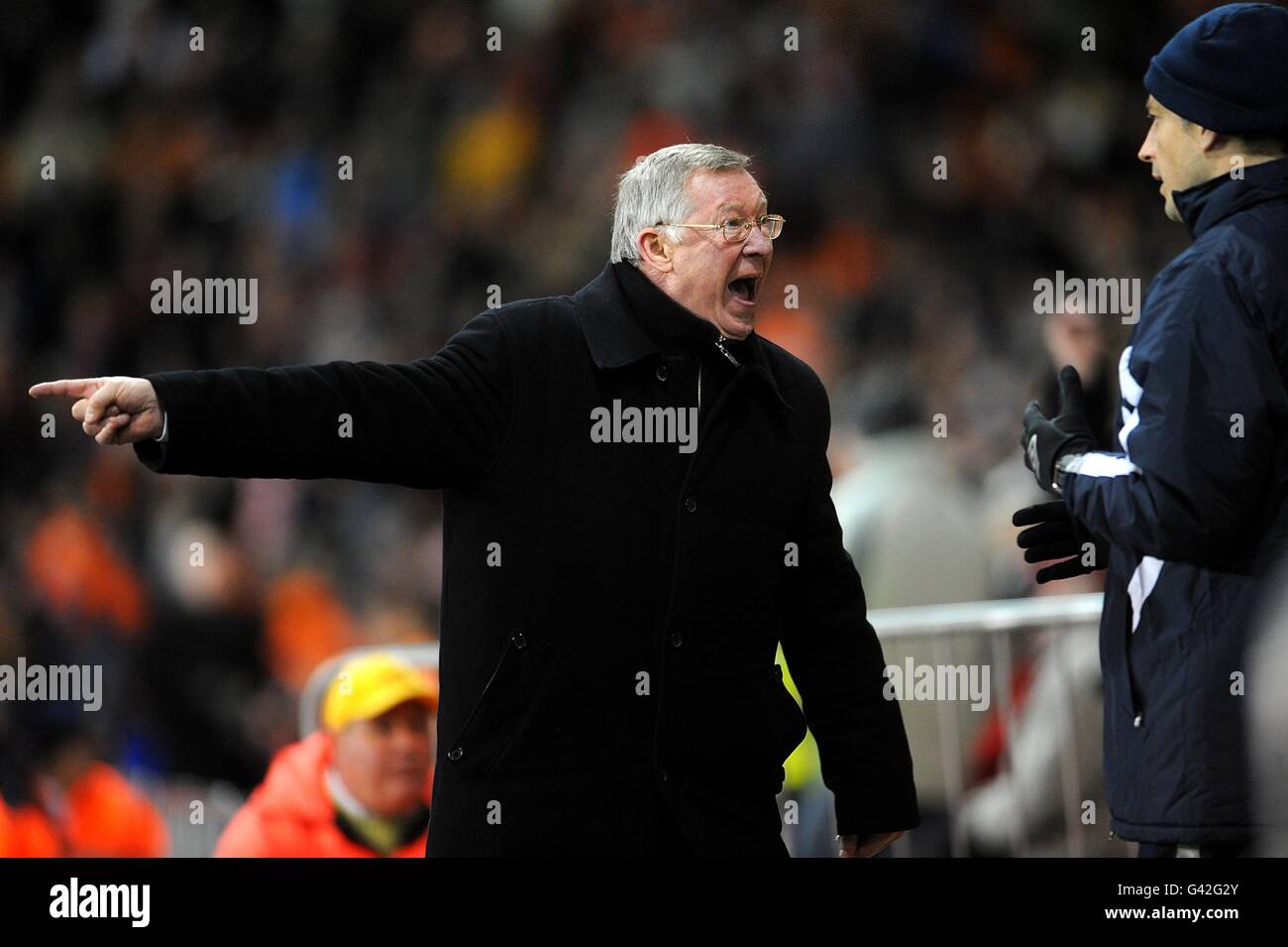 Manchester United manager Alex Ferguson (left) complains to fourth ...