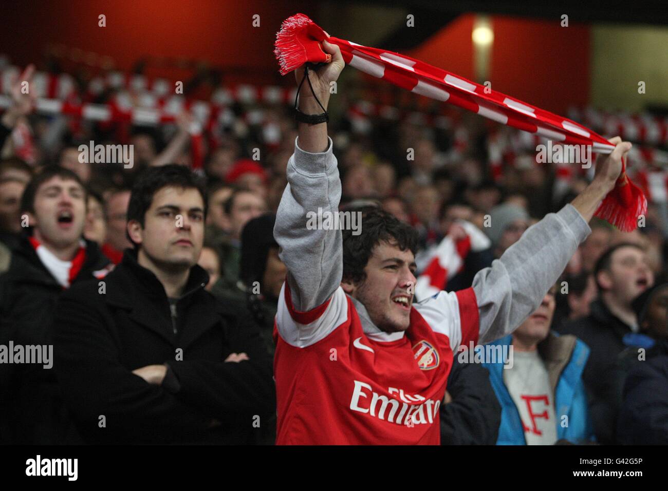 Arsenal fans celebrate in the stands hi-res stock photography and ...
