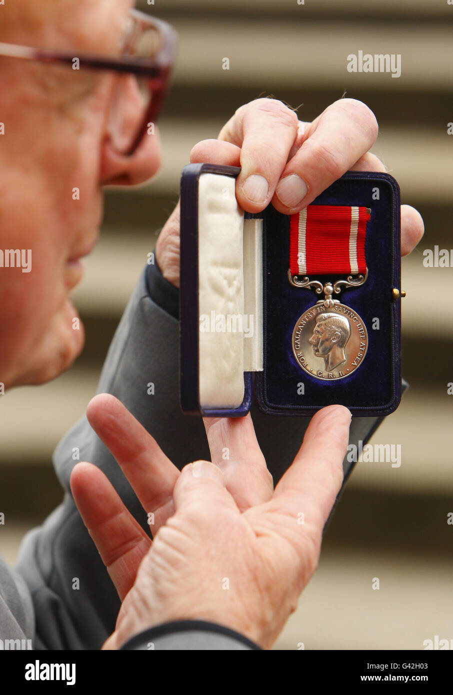 Raymond Morris proudly shows the Silver Sea Gallantry Medal ...