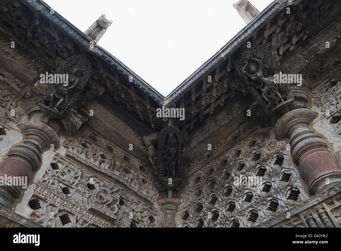 Ornate perforated window and Madanikas (celestial damsels) on top of ...