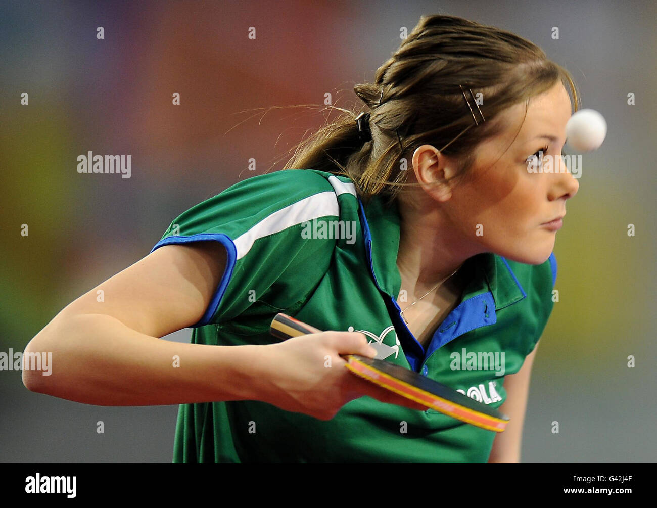 Guernsey's Alice Loveridge serves against Singapore's Mengyu Yu during ...