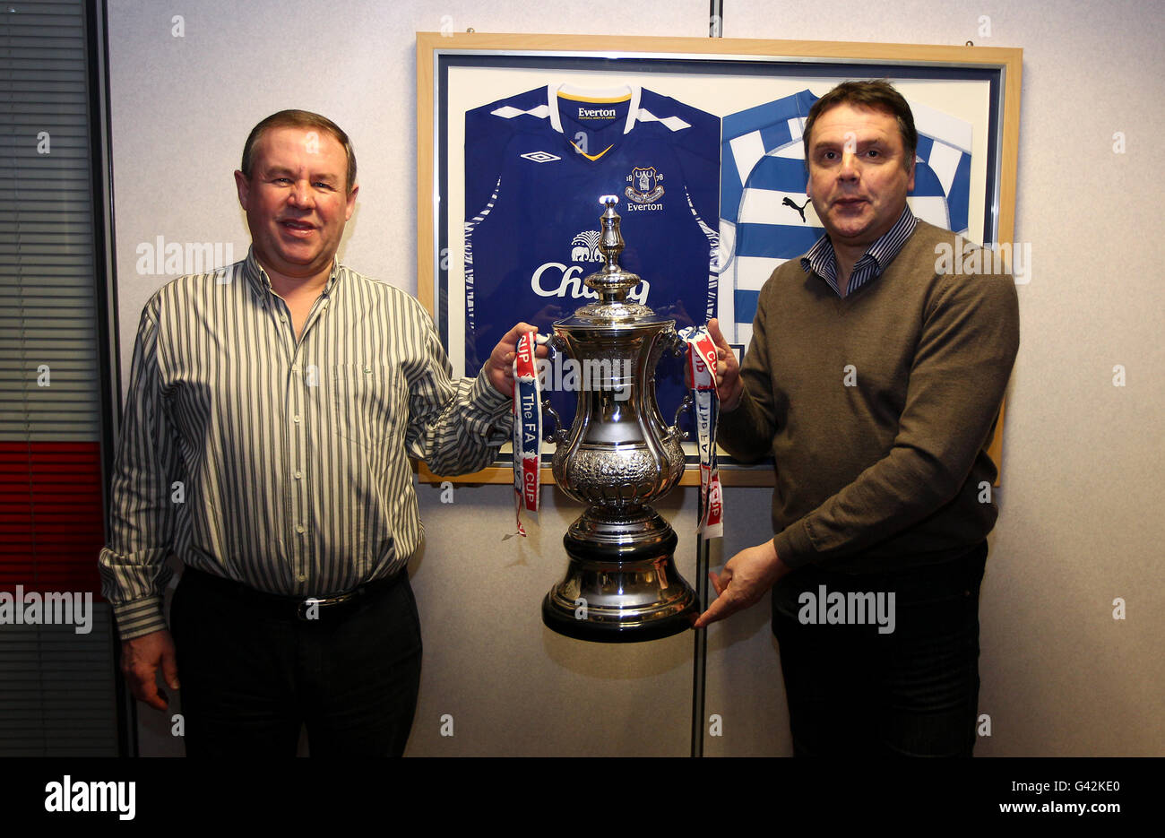 Former Everton player Graeme Sharp (right) poses with an employee of ...