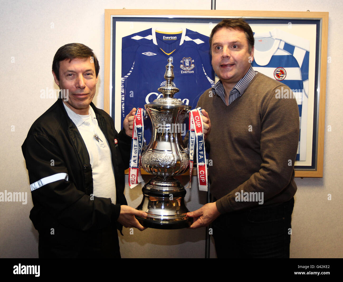 Former Everton player Graeme Sharp (right) poses with an employee of ...