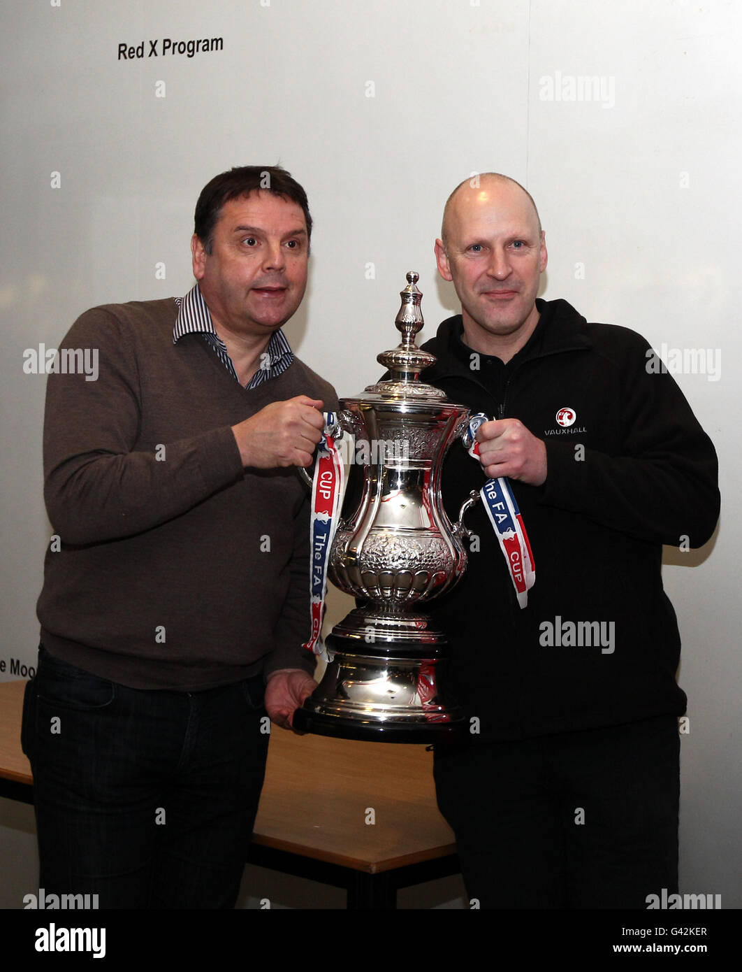 Former Everton player Graeme Sharp (left) poses with an employee of the ...